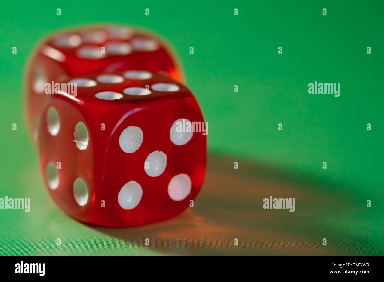 Closeup of a two red dice with a winning number on the top face on a ...