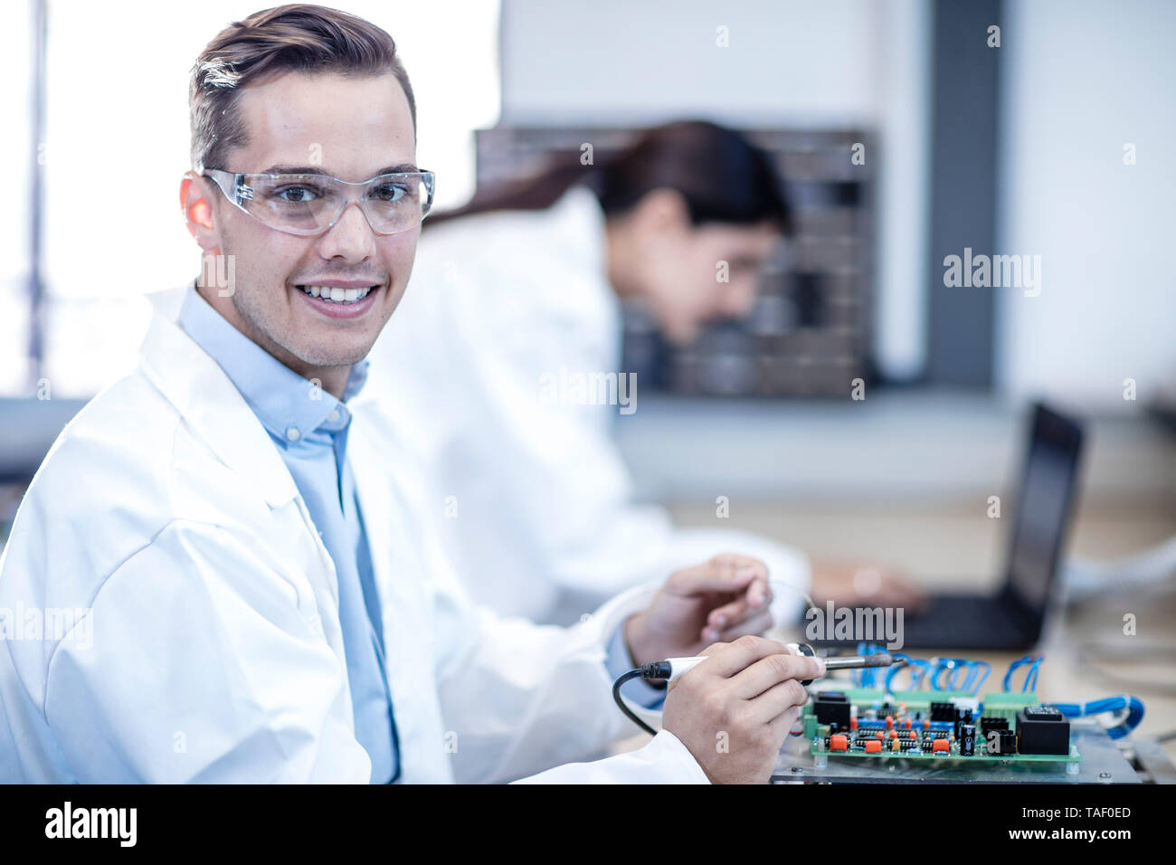 Female technician working motherboard hi-res stock photography and ...