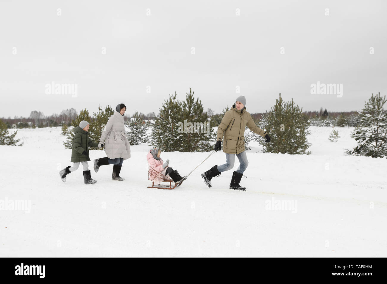 Boy pulling sledge hi-res stock photography and images - Alamy