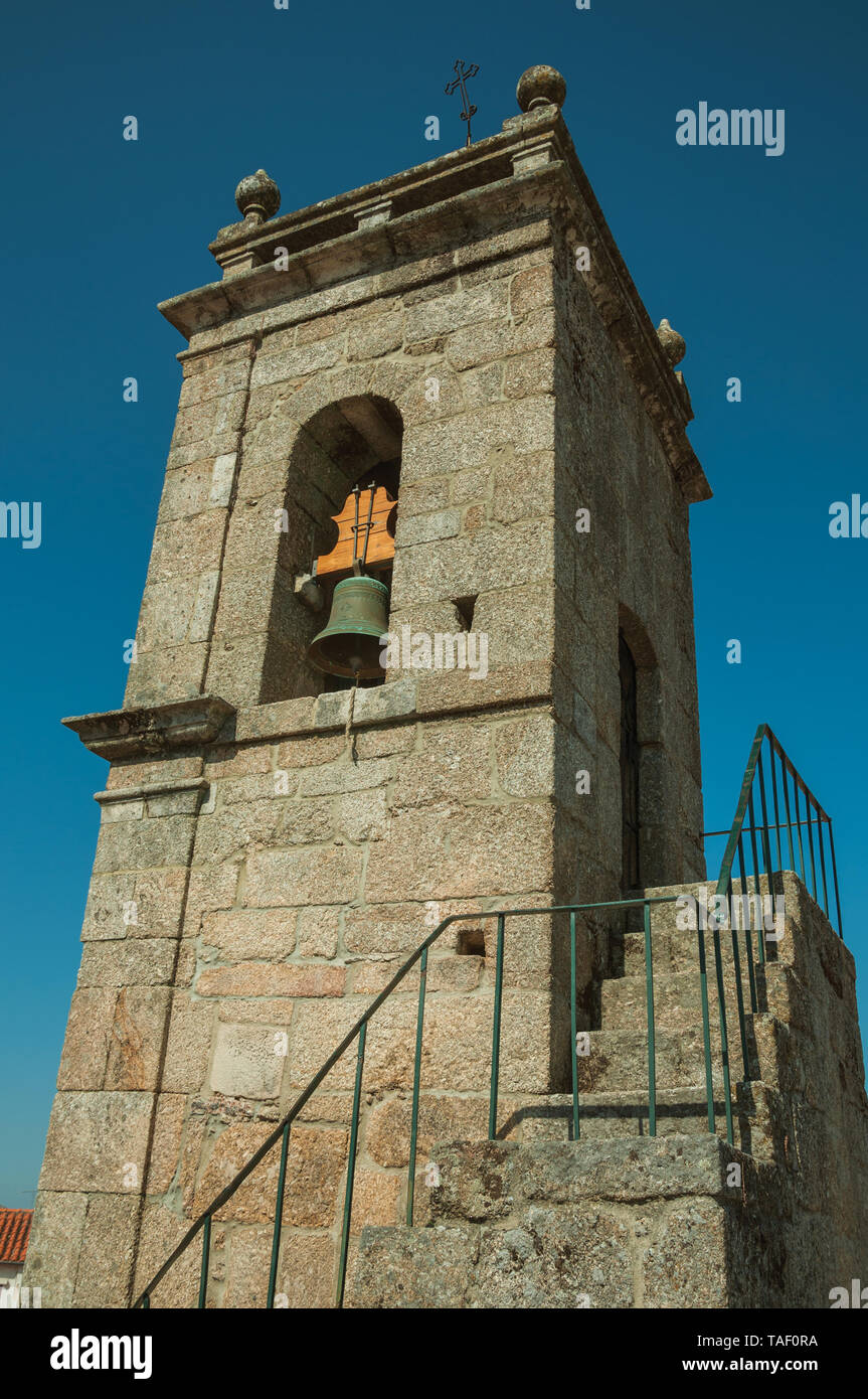 Medieval steeple made of stone with bronze bell and staircase with iron ...