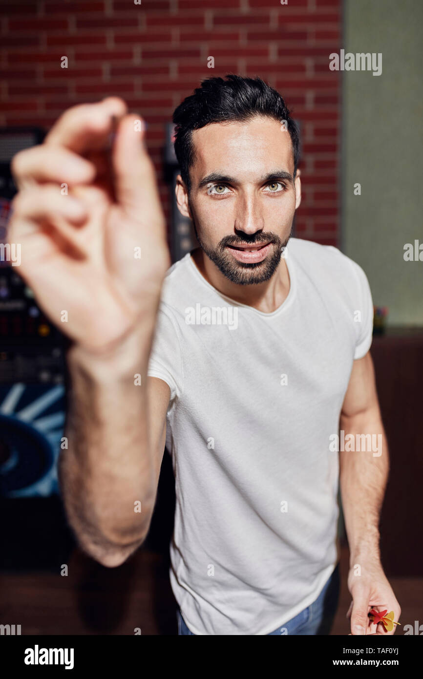 Portrait of man playing darts Stock Photo - Alamy