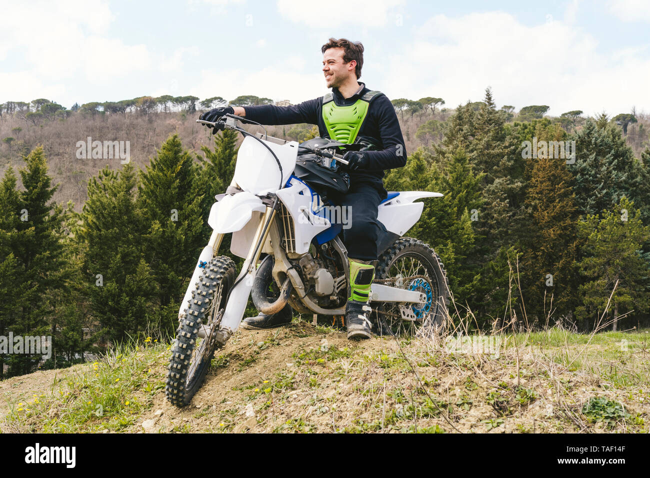 Portrait of confident motocross driver on circuit Stock Photo - Alamy