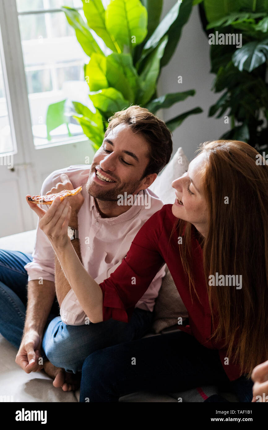 Friends having fun, eating pizza Stock Photo - Alamy