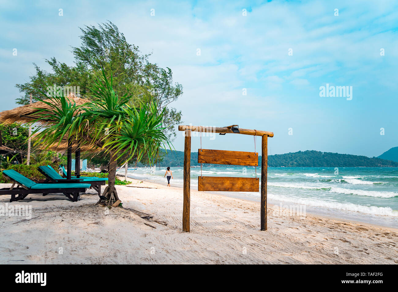 wooden signboard on tropical beach. A sign board for the name of the ...