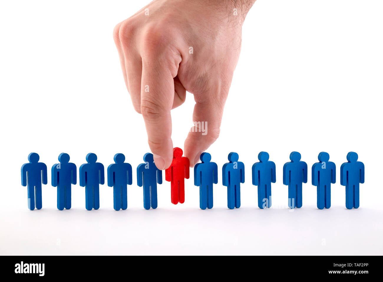 Man holds an employee in his hand. Personnel selection and management ...