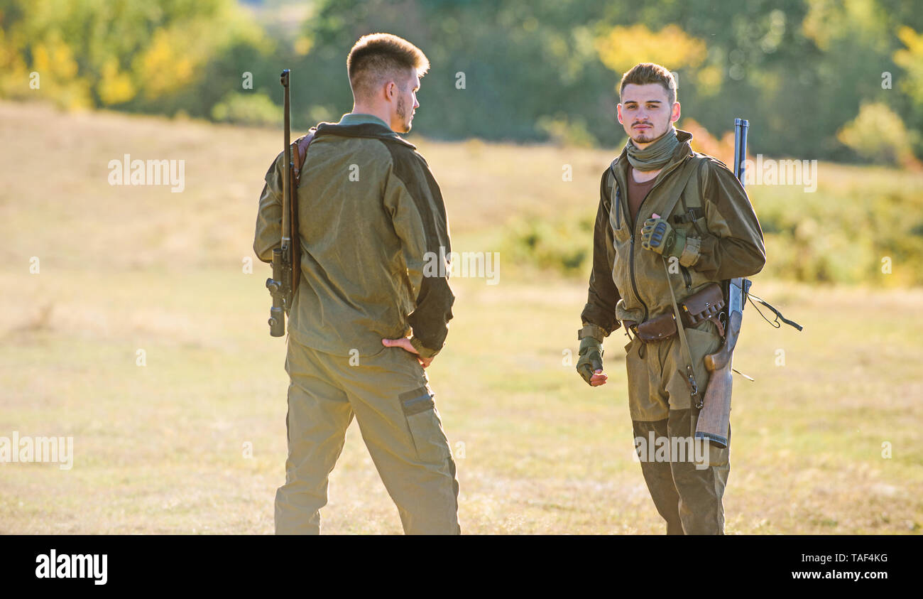 Man hunters with rifle gun. Boot camp. Military uniform fashion ...