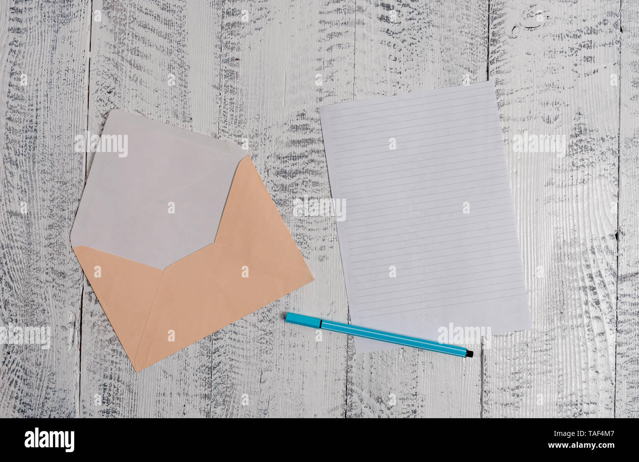 Open colored envelope blank sheet letter paper ballpoint wooden ...