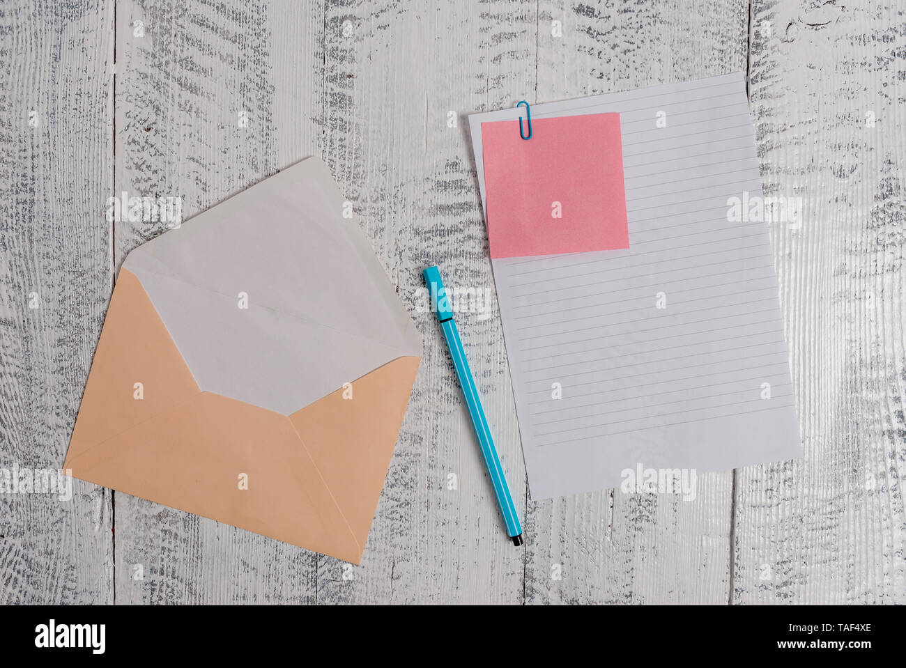 Envelope blank sheet letter paper sticky note ballpoint wooden ...