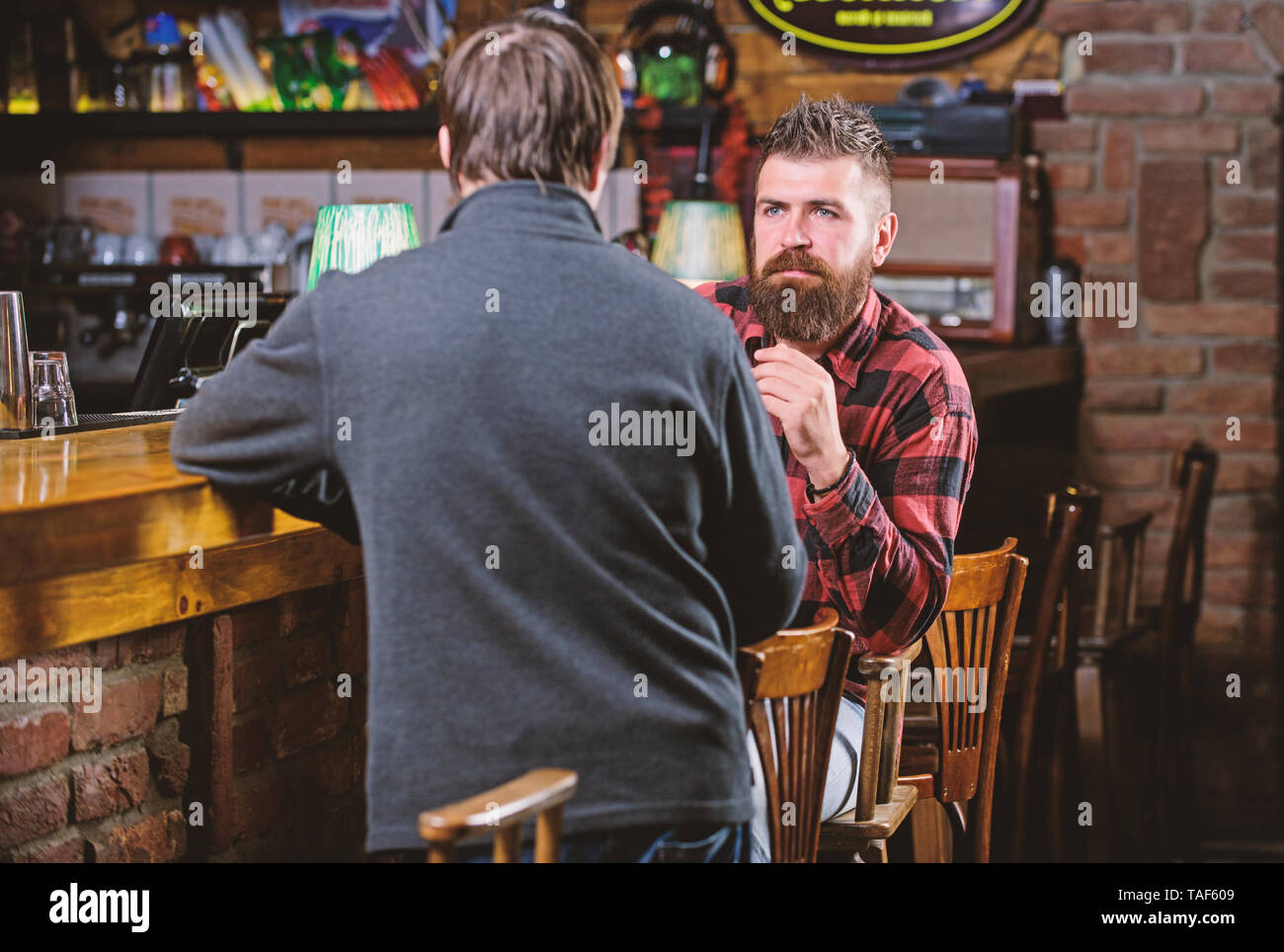 Friday relaxation in pub. Friends relaxing in pub. Friendly ...