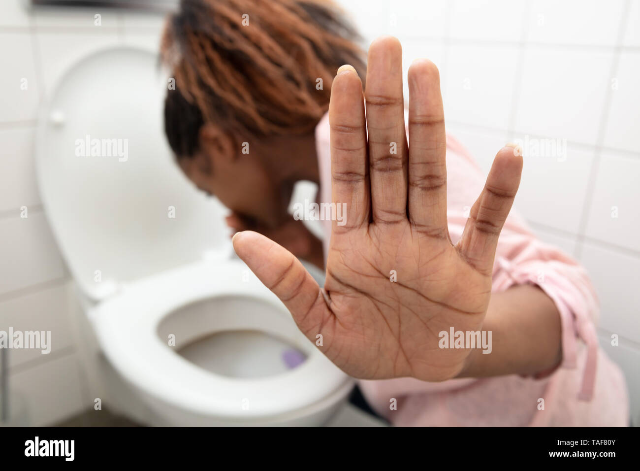 Female vomiting toilet hi-res stock photography and images - Alamy