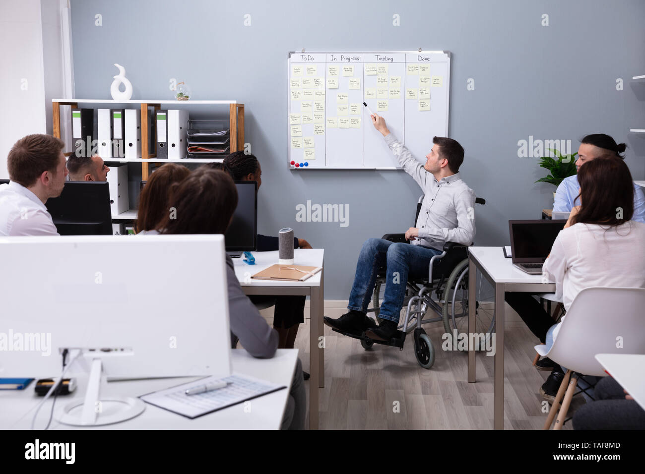 Businessman wheelchair presentation hi-res stock photography and images ...