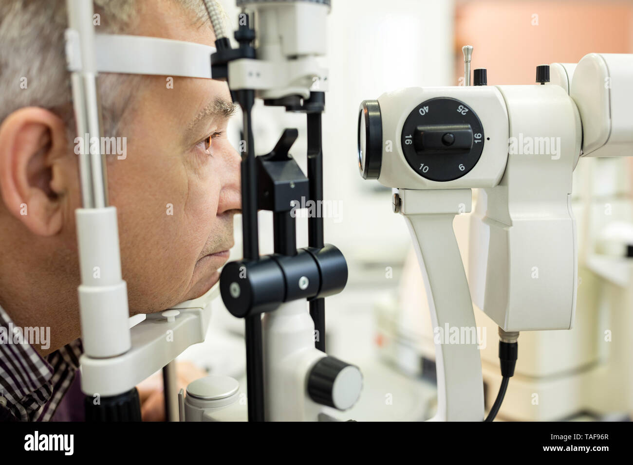 Patient in ophthalmology clinic man hi-res stock photography and images ...