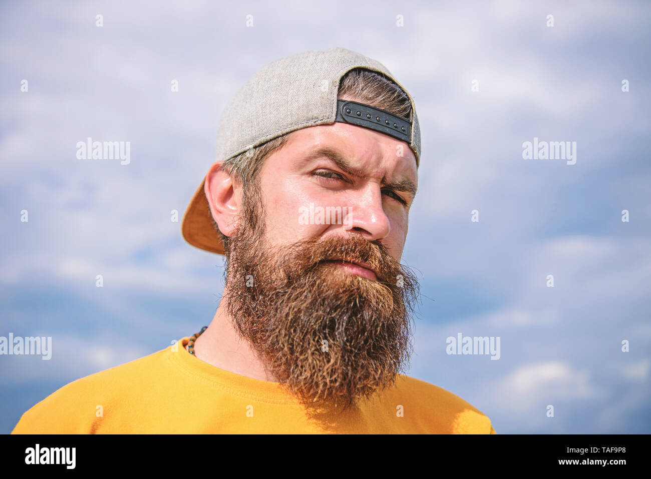 Young and carefree. Bearded hipster wear cap. Springtime concept ...