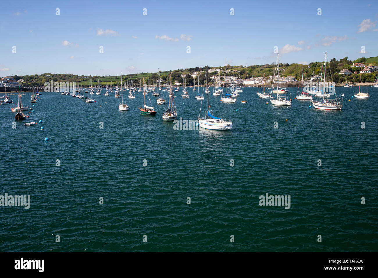 Boats at anchor in Falmouth deep water harbour in Cornwall, England ...