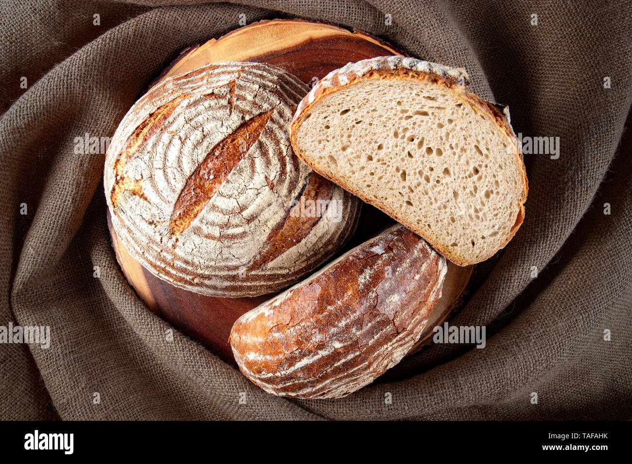 Three rye bread placed together on wood and burlap canvas Stock Photo ...