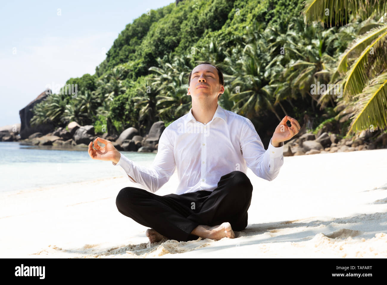 Mediating person on beach hi-res stock photography and images - Alamy