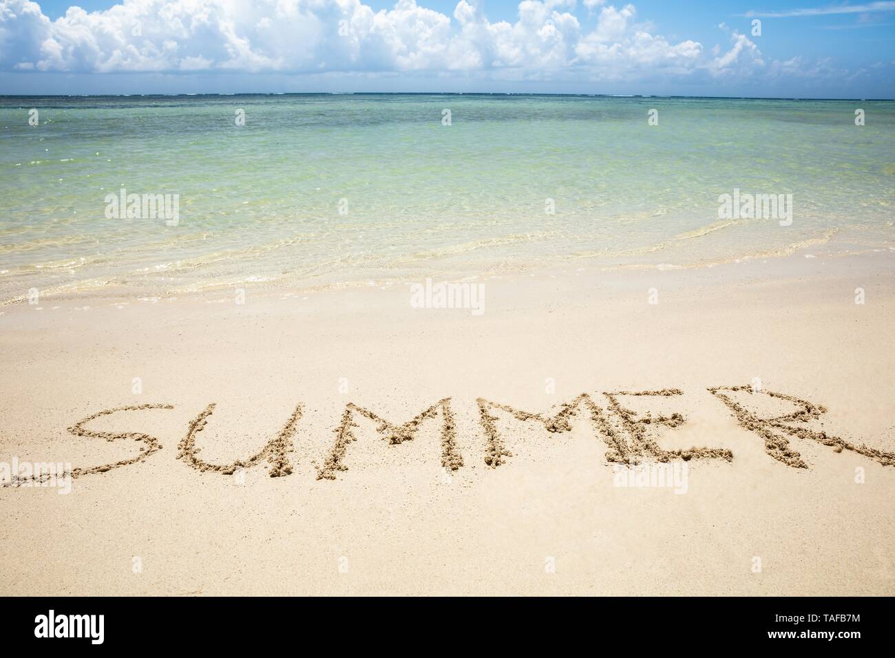 Summer Written Text On Sand Near The Idyllic Sea At Beach Stock Photo ...