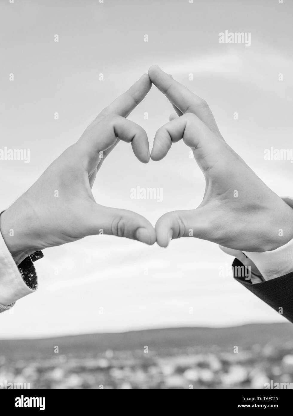 Male hands in heart shape gesture symbol of love and romance. Hand ...