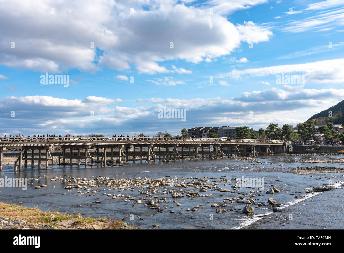 Togetsu-kyo bridge over katsuragawa river with colourful forest ...