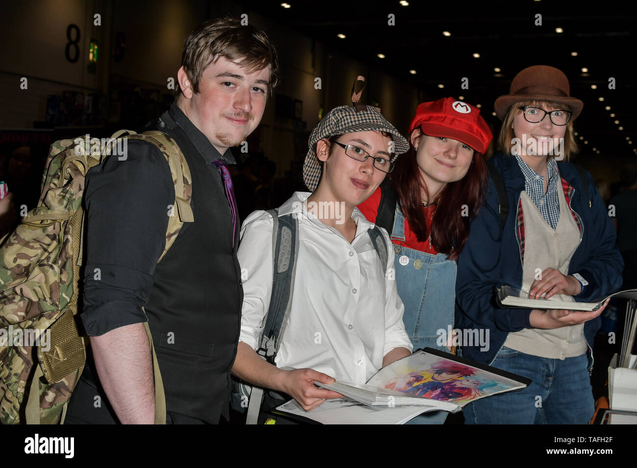 Comic fans looking at a stall GuiZang (www.guizang.co.uk) by artist ...