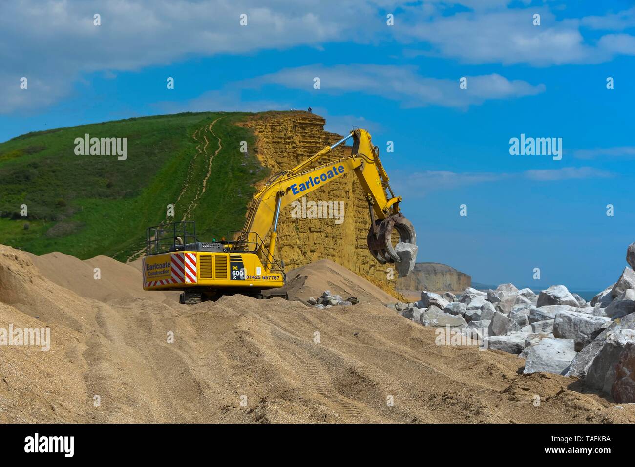 Two diggers beach hi-res stock photography and images - Alamy