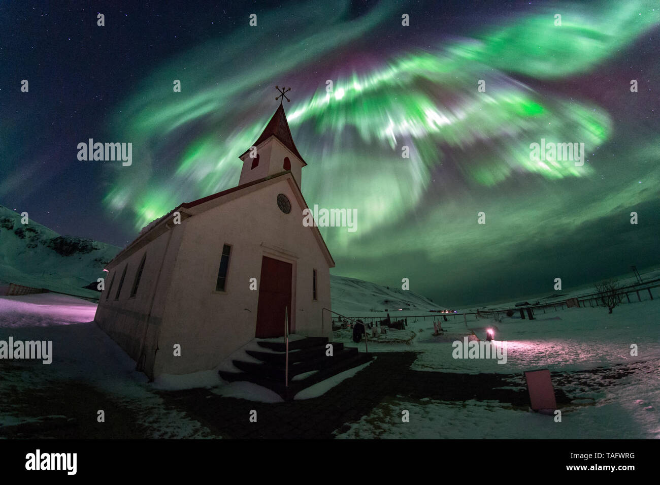 Aurora borealis and Reyniskirkja church in southern Iceland. During a ...