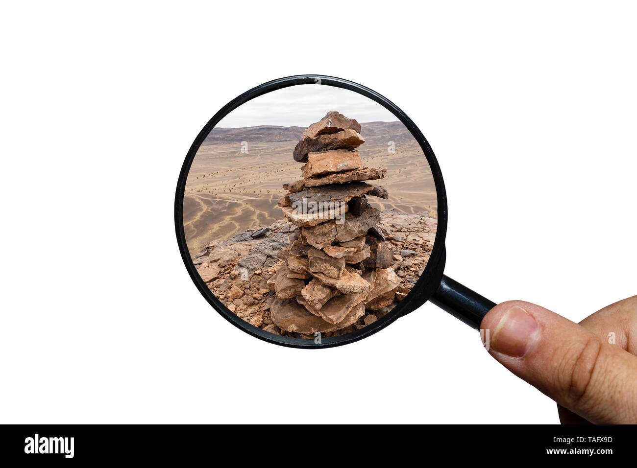 Stone pile mark on the mountain peak, view through a magnifying glass ...