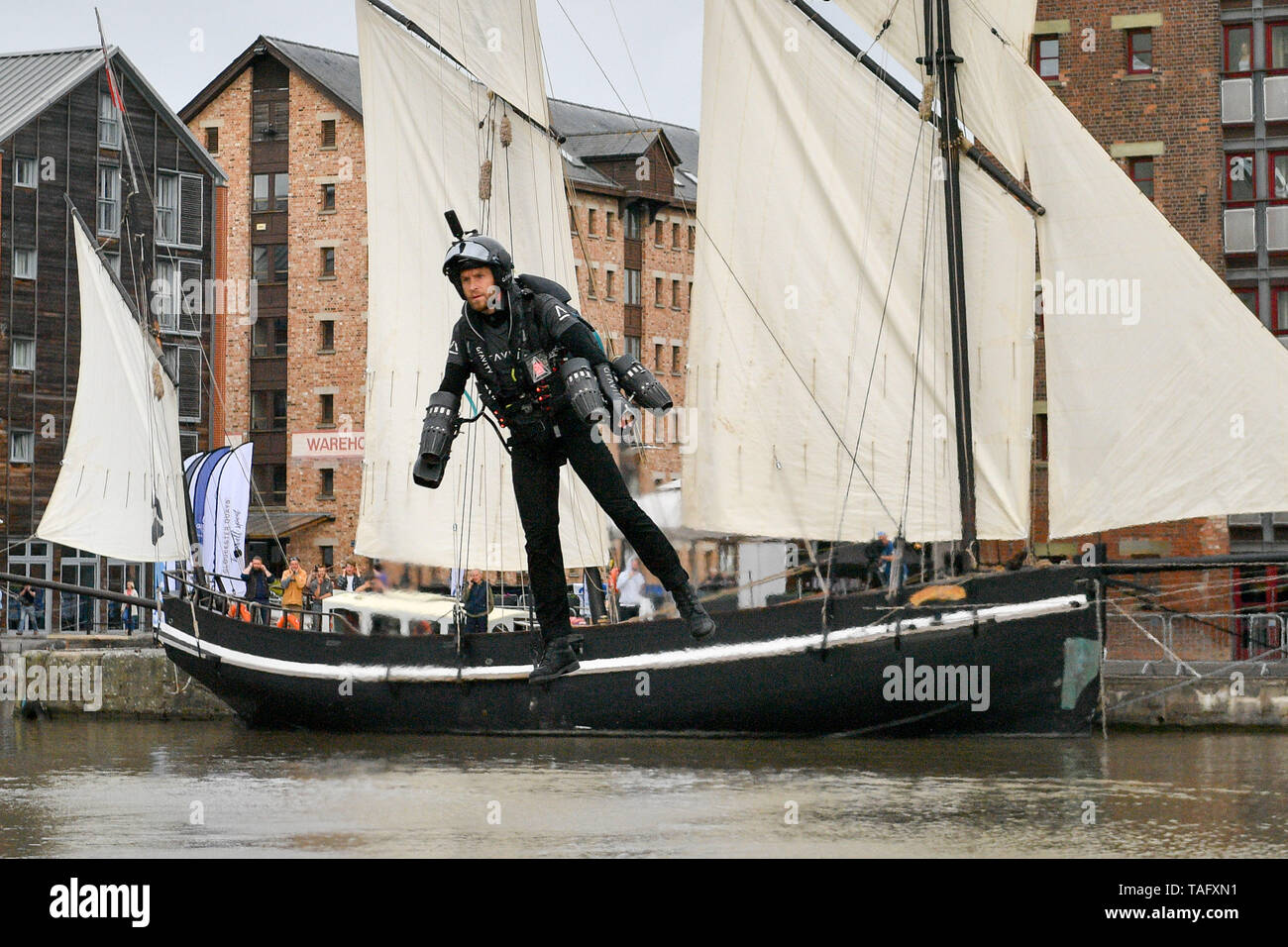 A Gravity Industries Jet Suit pilot flies over the water at Gloucester ...