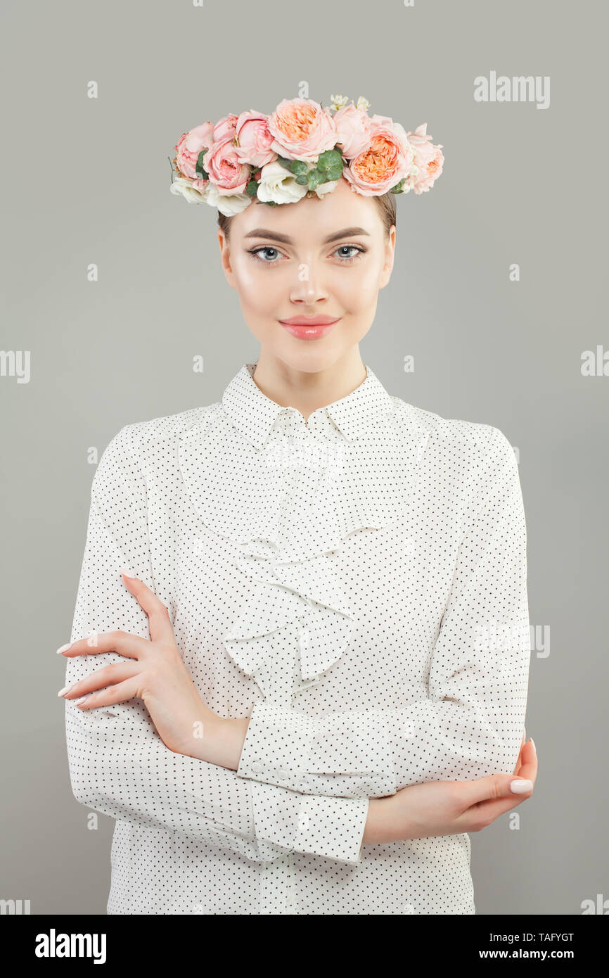 Spring woman portrait. Beautiful model girl in white shirt and flowers ...