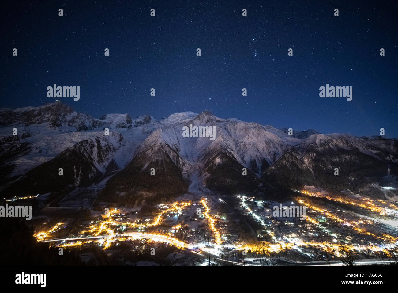 Sea of clouds lit by the Arve valley, by night, and Milky Way, facing ...