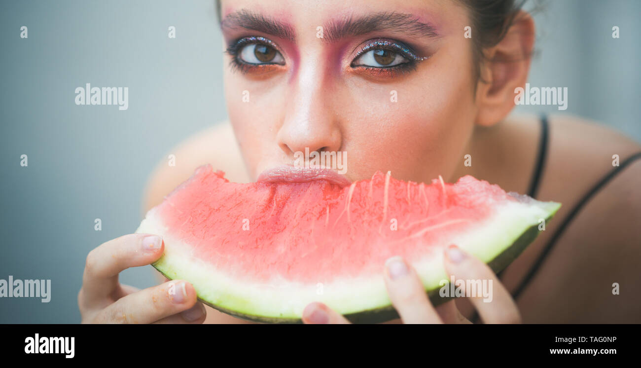 Beauty, look, visage. Young woman eat juicy watermelon. Girl with ...