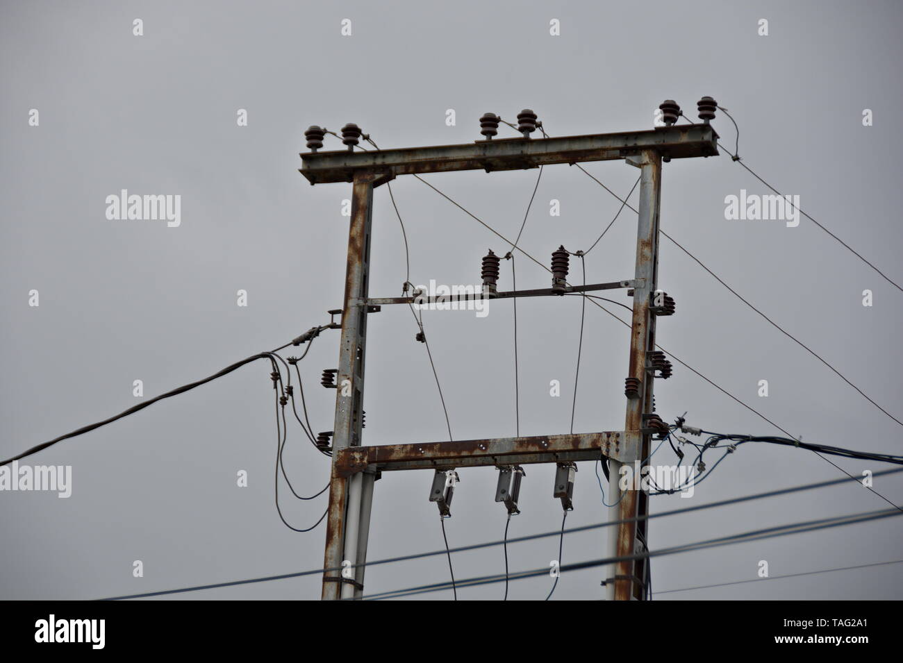 Double metal electrical pillars with the high voltage wires Stock Photo ...