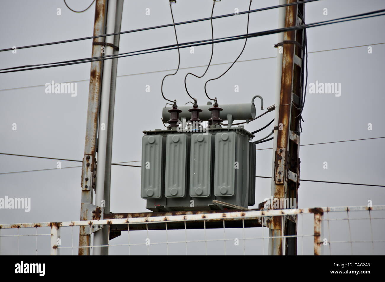Electrical transformator mounted on electrical pillars Stock Photo - Alamy
