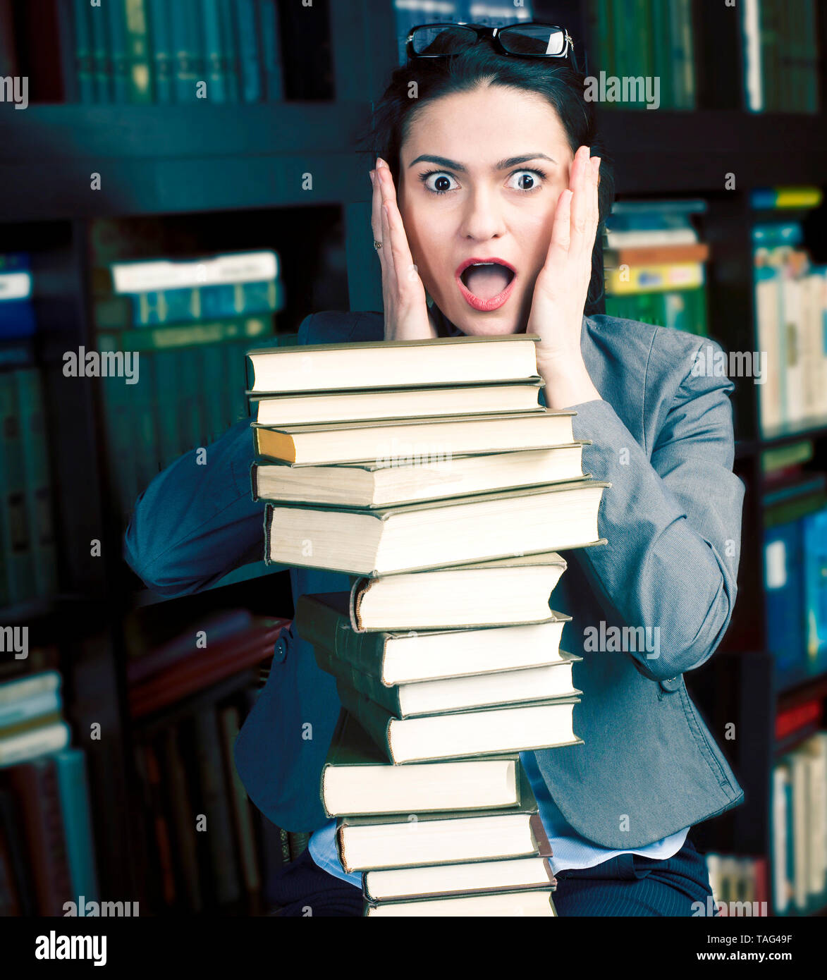 Beautiful woman reading many books hi-res stock photography and images ...