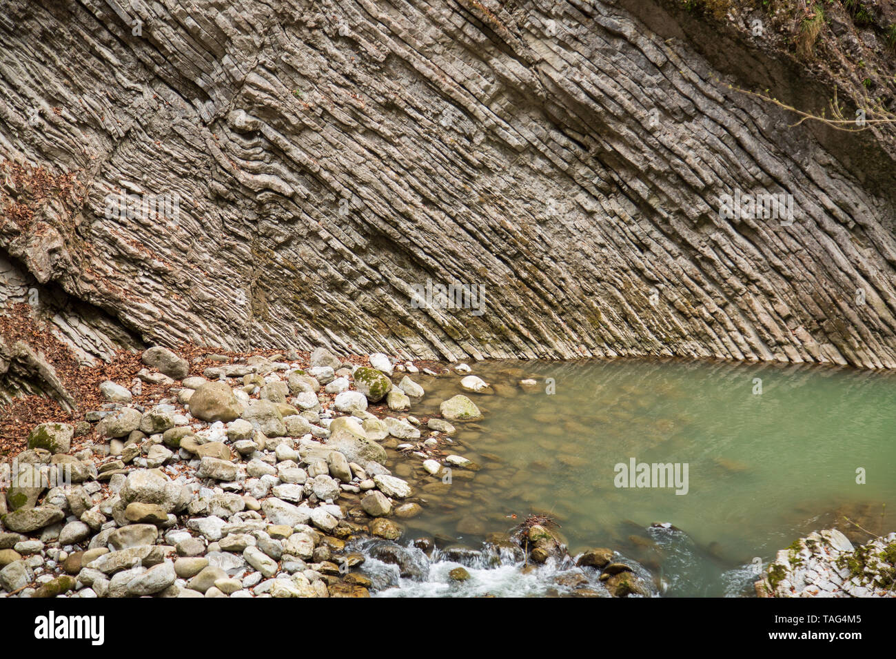 Interesting layered geological stone formation in river canyon Stock ...
