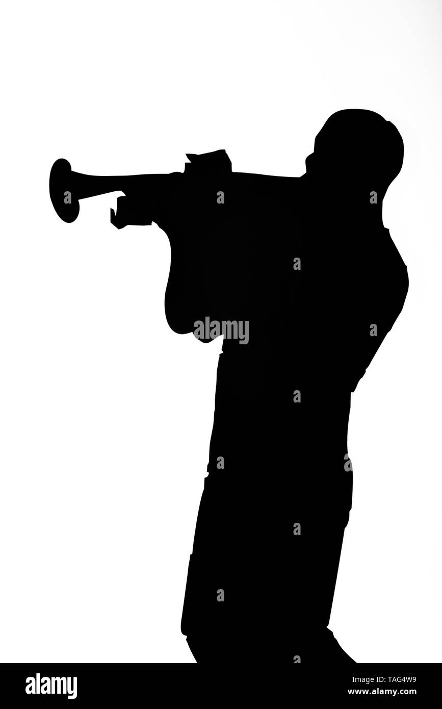 Isolated shadow of a musician on white background in studio Stock Photo ...