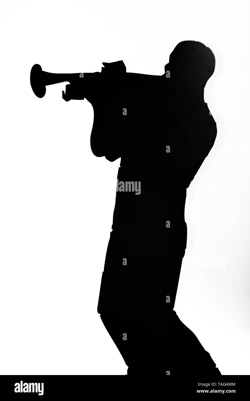 Isolated shadow of a musician on white background in studio Stock Photo ...