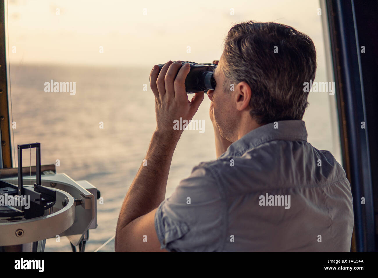 Navigational officer lookout on navigation watch at sea Stock Photo - Alamy