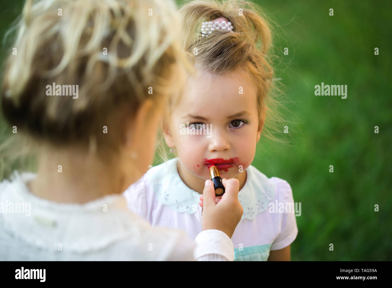 Children on lipstick hi-res stock photography and images - Alamy