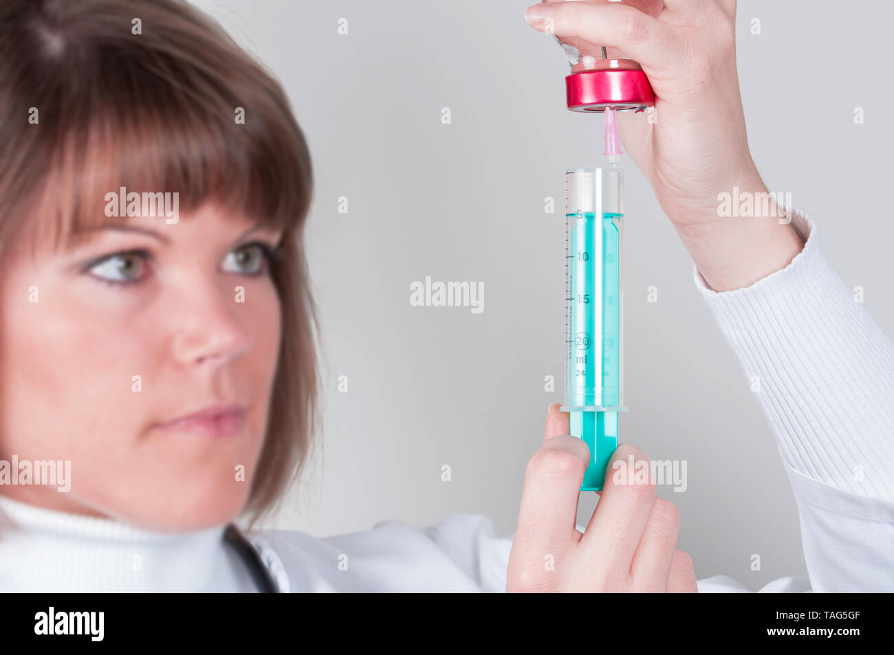 Nurse preparing injection for patient isolated on white Stock Photo - Alamy