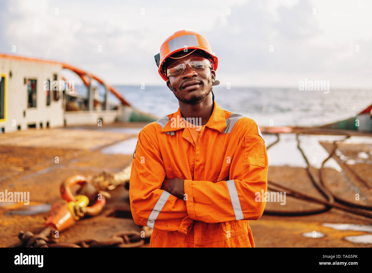happy Seaman AB or Bosun on deck of vessel or ship Stock Photo - Alamy