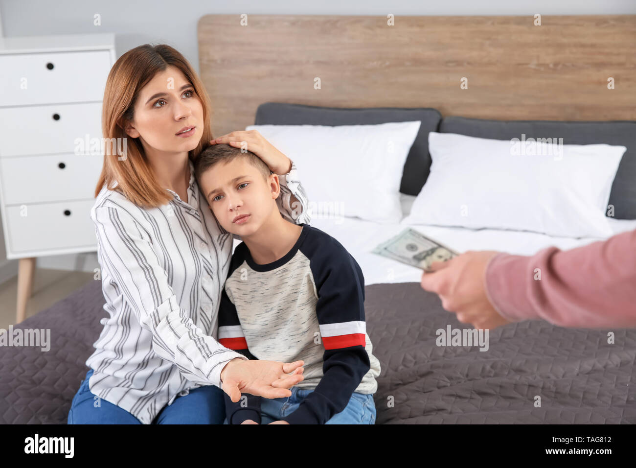 Man giving alimony to his ex-family at home Stock Photo - Alamy
