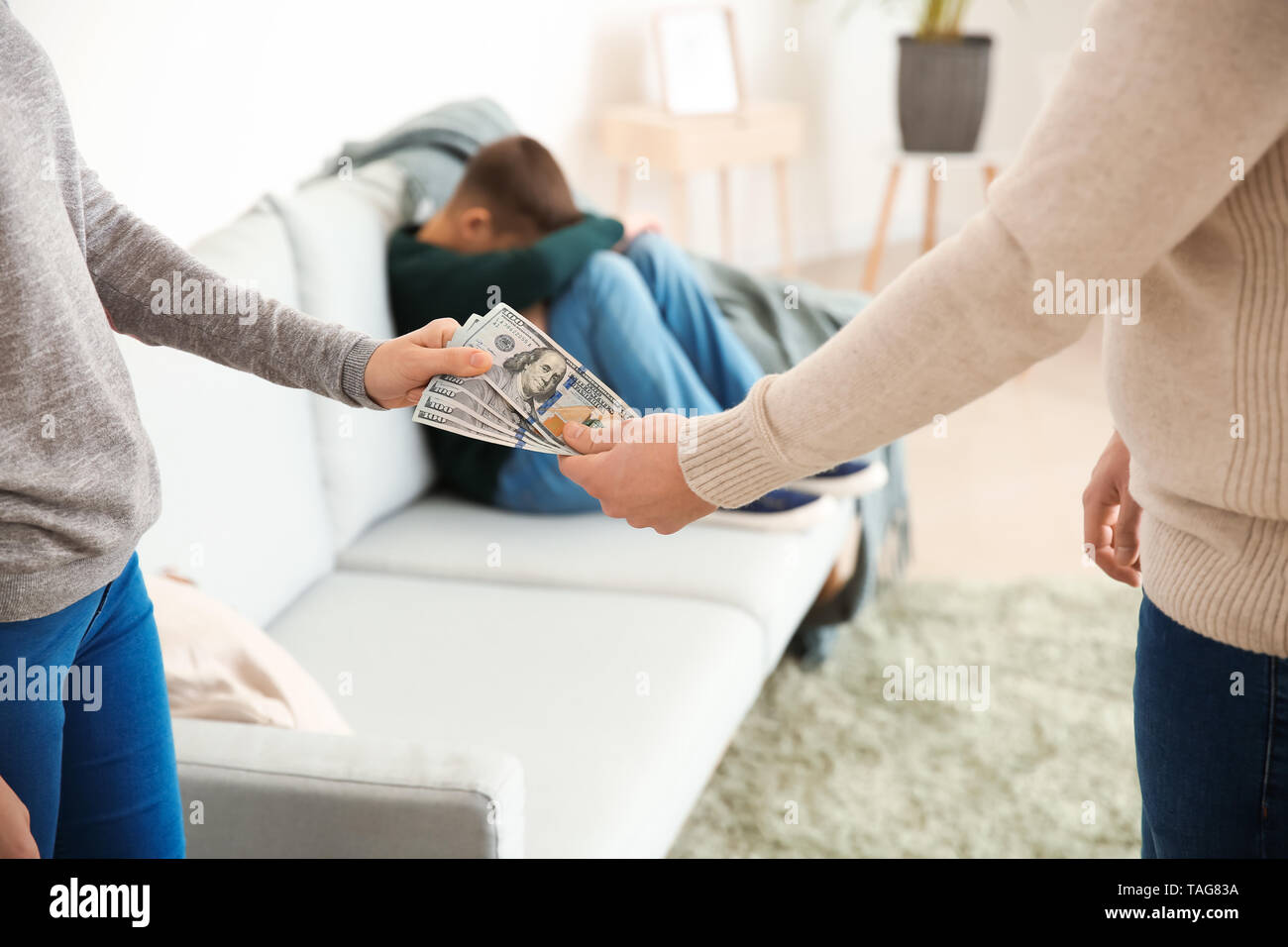 Man giving alimony to his ex-wife at home Stock Photo - Alamy
