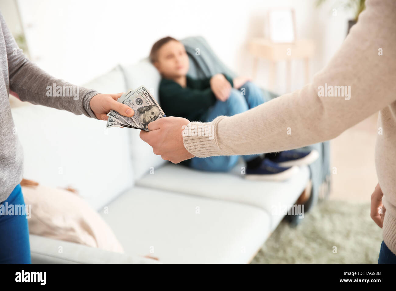 Man giving alimony to his ex-wife at home Stock Photo - Alamy