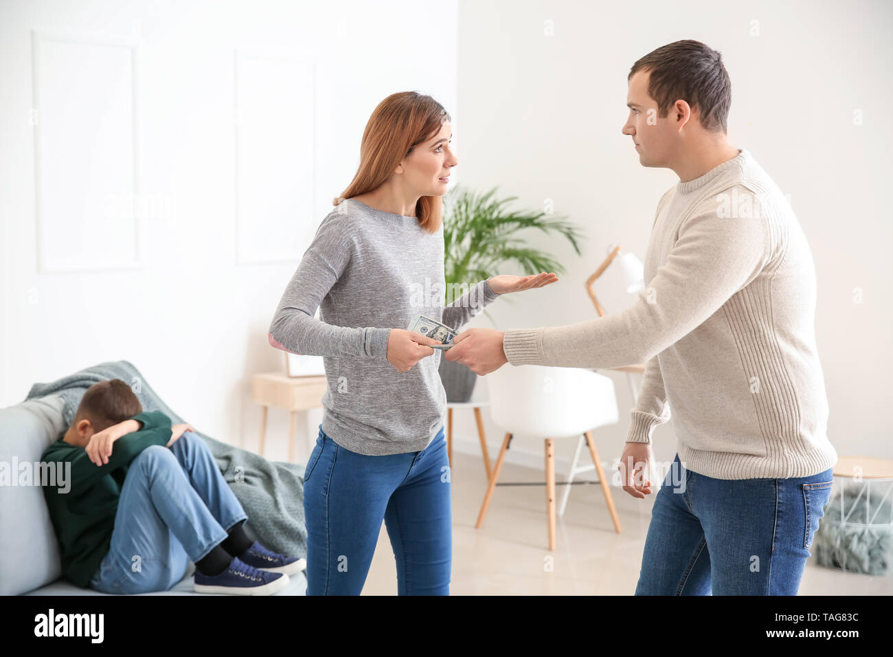 Man giving alimony to his ex-wife at home Stock Photo - Alamy