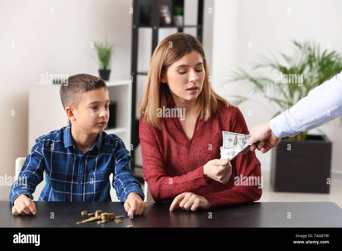 Man giving alimony to his ex-family in lawyer's office Stock Photo - Alamy