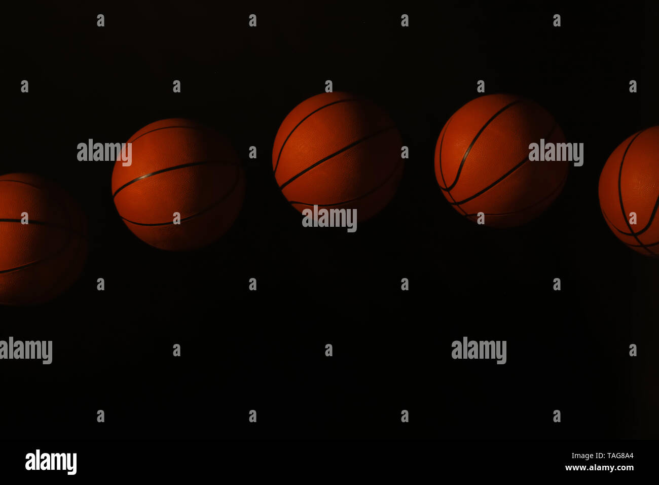 Stroboscopic photo of moving ball on dark background Stock Photo - Alamy