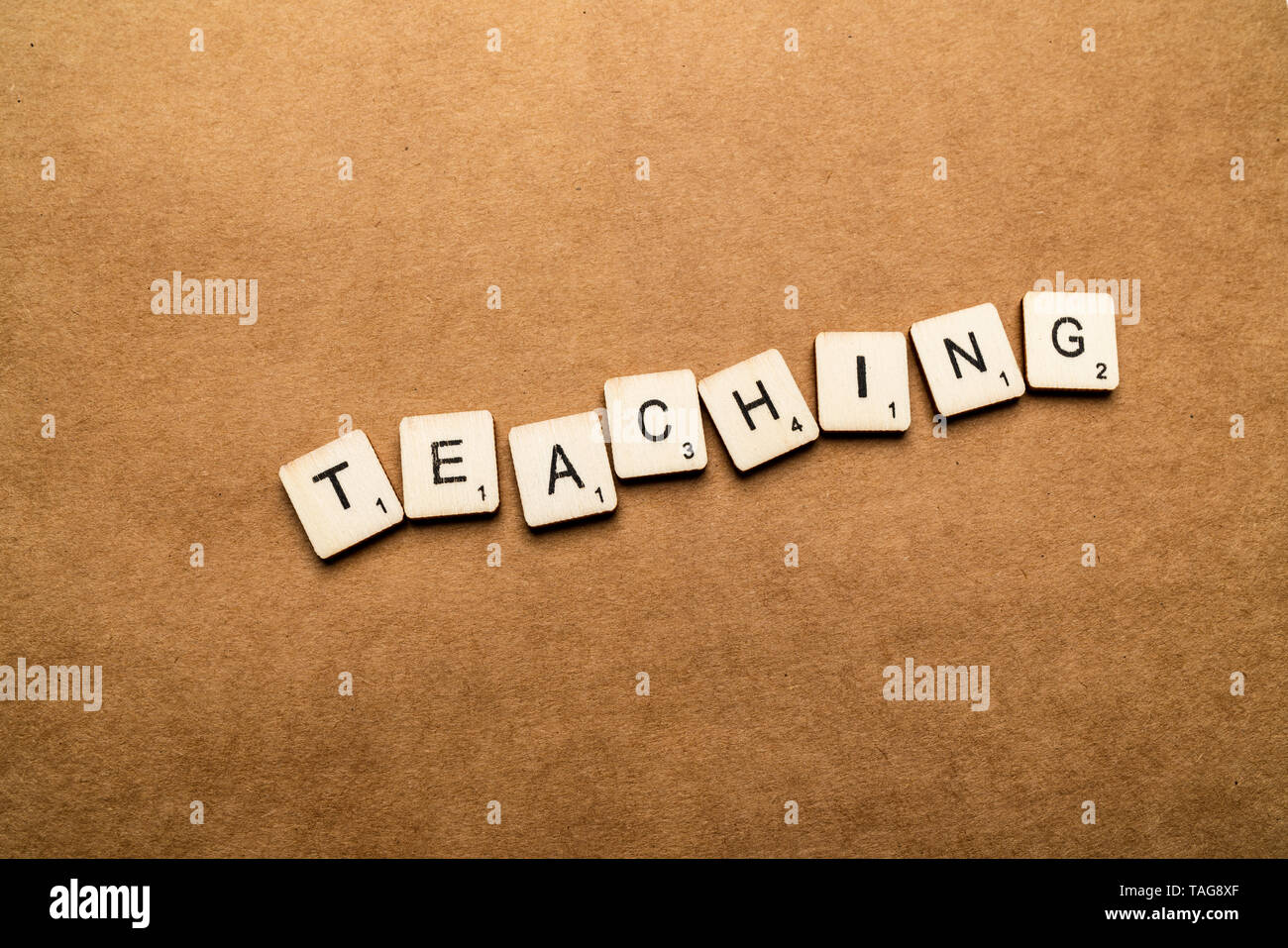 LONDON, UK - May 24 2019: The word TEACHING, spelt with wooden letter ...