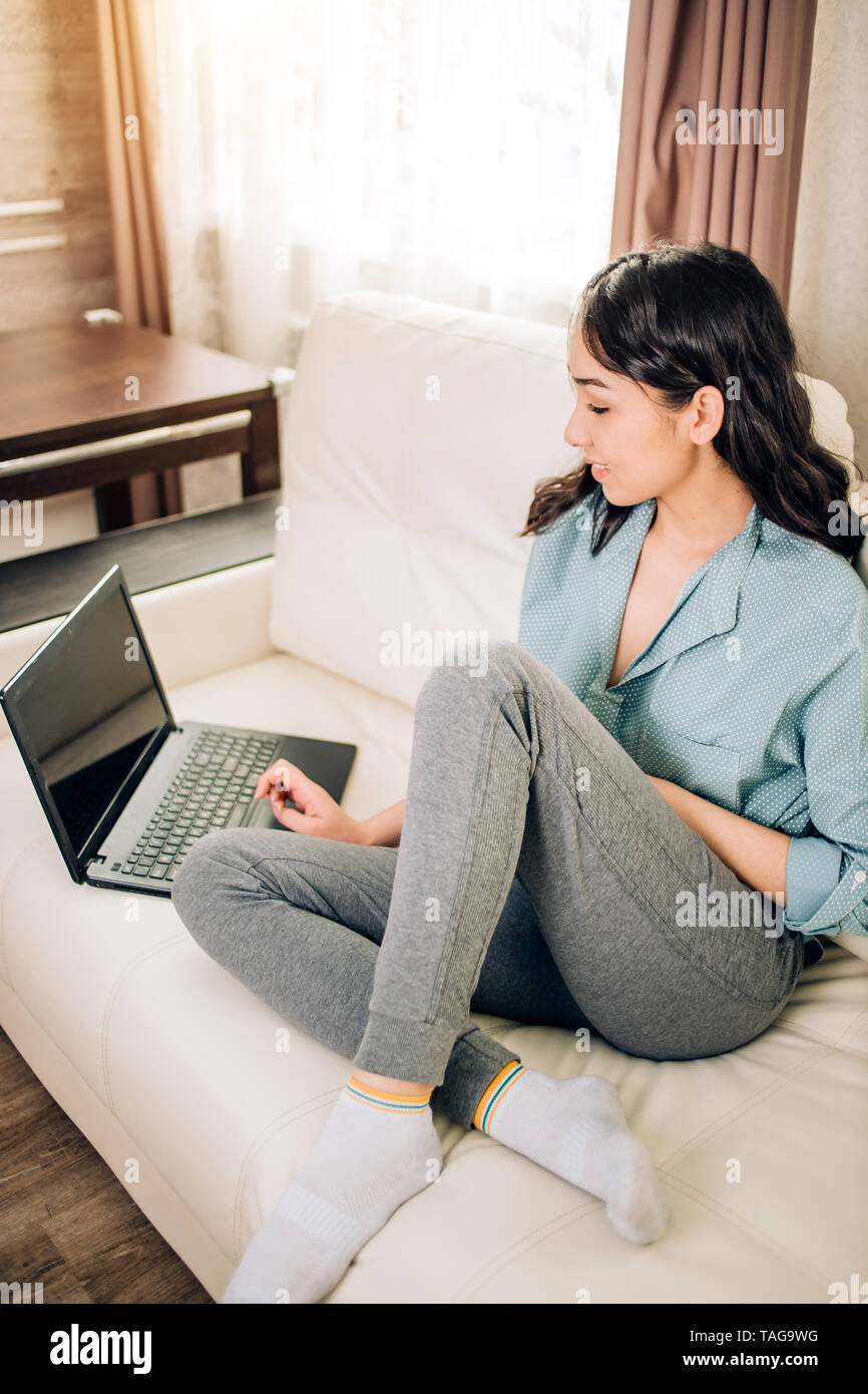 Beautiful girl relaxing laptop legs hi-res stock photography and images ...