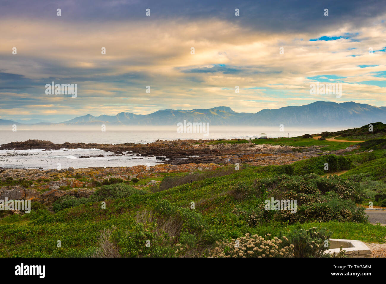 Rocky coast line on the ocean at De Kelders, South Africa, famous for whale watching. Winter ...